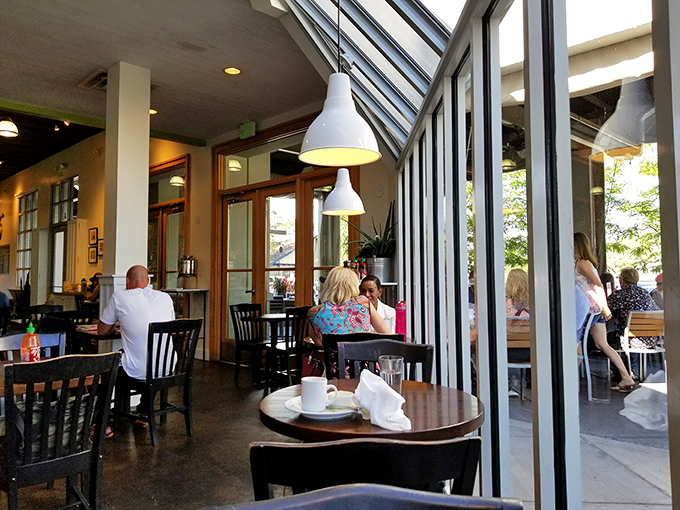 The side windows create a space where inside meets outside, and conversations flow as freely as the coffee—the perfect backdrop for morning revelations.