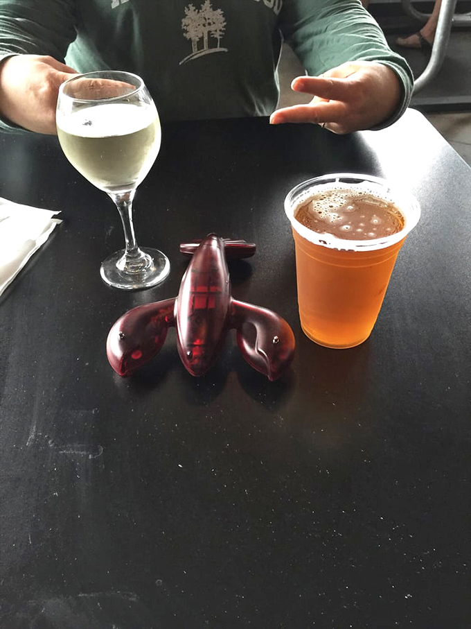 The unofficial drink pairing rule: white wine for sophistication, beer for tradition, and a lobster-shaped bottle opener because... well, obviously.