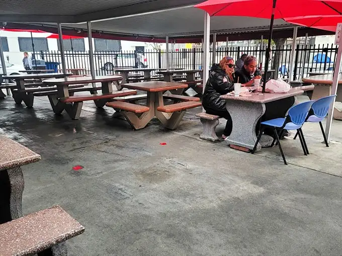 Al fresco dining, LA-style. Red umbrellas provide shade while concrete tables offer no pretense – just a place to focus entirely on your seafood.