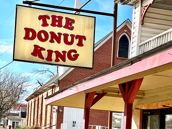 The sign says it all – royalty resides here. In the kingdom of fried dough, this place wears the crown with sugary dignity.