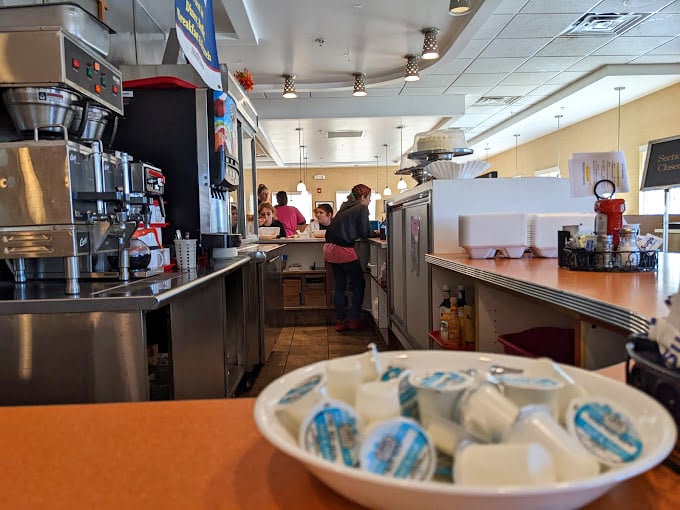 Where the magic happens—the diner's heartbeat is its kitchen and counter, where coffee cups never stay empty for long.