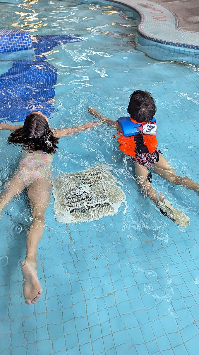 Learning to swim is serious business—until it isn't. These young water enthusiasts are mastering skills while thinking they're just playing.