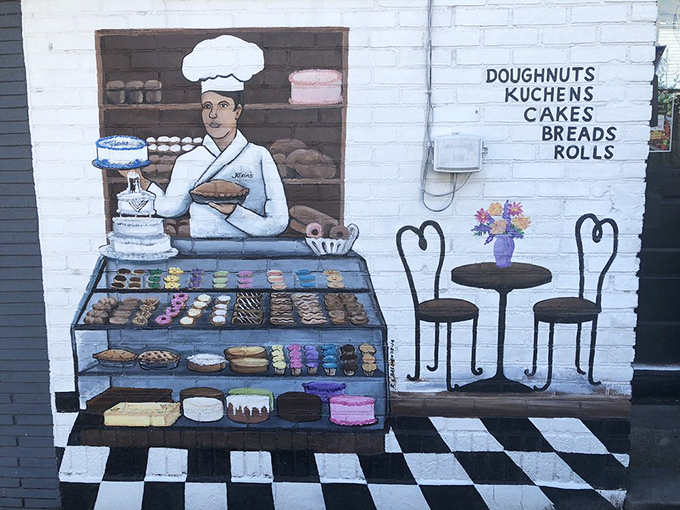 The exterior mural tells you everything you need to know—this is a place that takes donuts seriously while never taking itself too seriously.