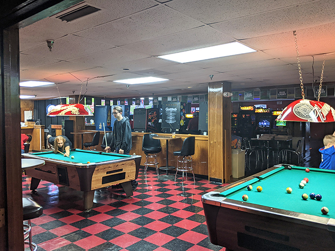 Pool tables offer a change of pace with their checkered surroundings, proving Professor Bowl understands that variety is the spice of entertainment.