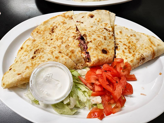 The Reuben quesadilla: proof that cultural fusion isn't just for fancy restaurants. Sauerkraut and tortillas living in delicious harmony.