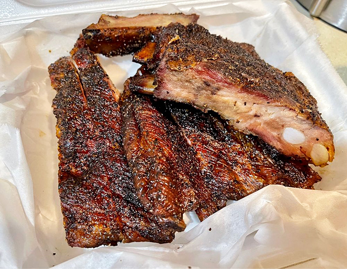 Ribs with the perfect "tug"—not falling off the bone (that's overdone) but surrendering with just enough resistance to remind you they're worth the effort.