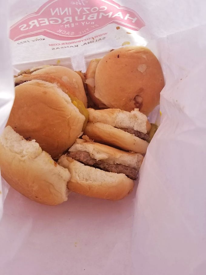 White paper bag, full of promise. Like Christmas morning for your taste buds, but with more onions and less wrapping paper.