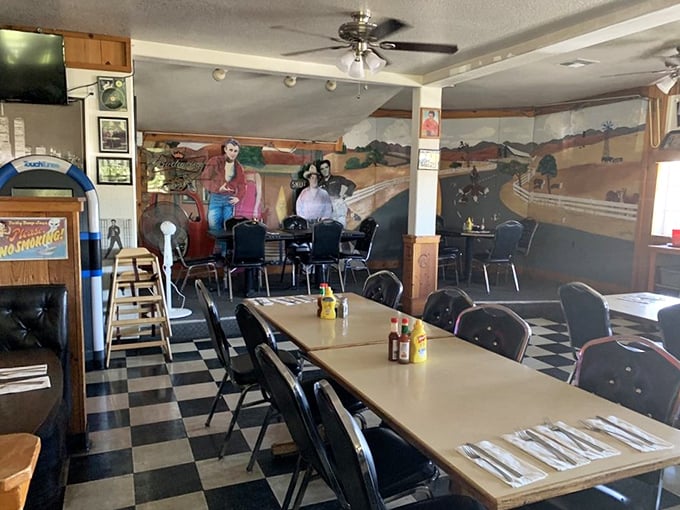 A mural of simpler times watches over diners as they feast. The checkered floor isn't just decoration—it's an invitation to step back in time.