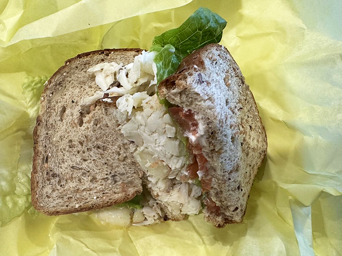 Crab sandwich architecture at its finest—structural integrity maintained despite generous filling. Engineering you can eat.