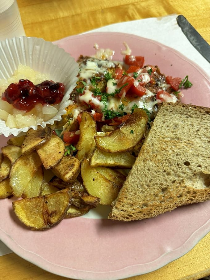A hearty frittata with home fries and toast that says, "Today is going to be amazing." The little cup of preserves is the cherry on top.