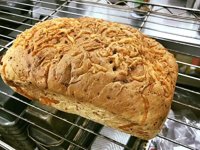 Herb cheese bread that looks like it's auditioning for a rustic food magazine – crusty, golden, and begging to be torn apart.