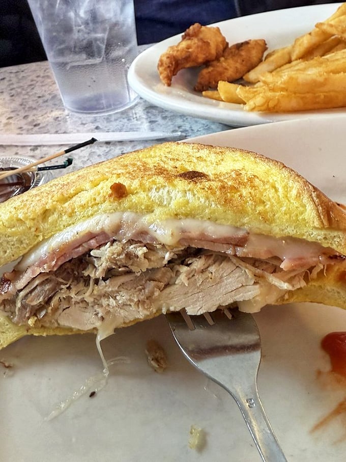 The Monte Cristo: where breakfast and lunch collide in a glorious explosion of ham, turkey, and melted cheese, all wrapped in golden egg-battered bread.