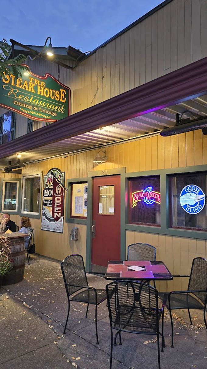 When the evening air calls, these outdoor tables answer. The neon glow welcomes hungry travelers like moths to a delicious flame.