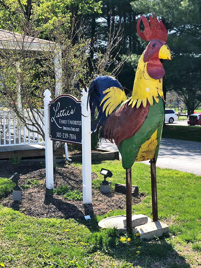 The colorful rooster statue isn't just decoration—it's the unofficial mayor of Lettie's, welcoming hungry travelers to this "Family Favorites" destination.