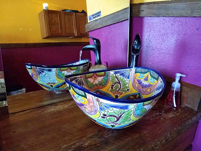 Even the bathroom sinks tell a story of colorful craftsmanship. These aren't fixtures—they're conversation pieces that make handwashing an event.