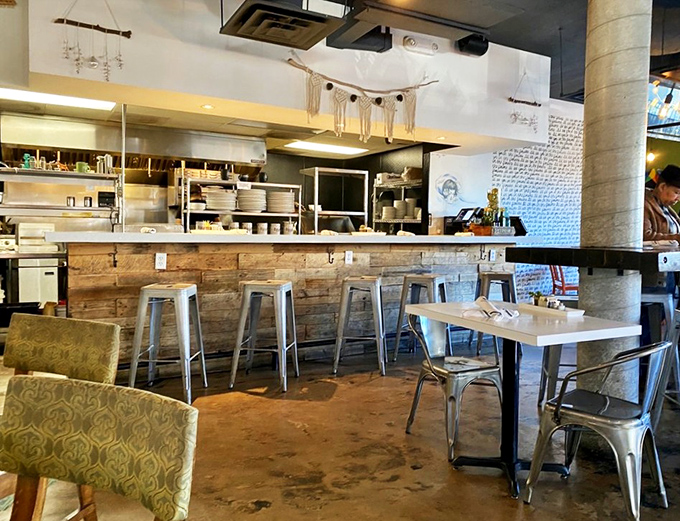 The open kitchen concept – where culinary transparency meets rustic wood and metal. Watch your breakfast come to life before it changes yours.