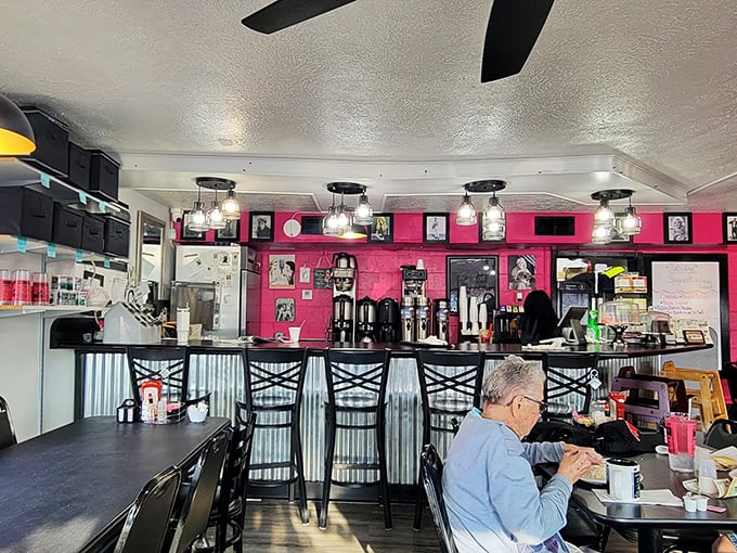 The counter and coffee station serves as command central for this pink palace of comfort cuisine, where regulars find their usual spots.