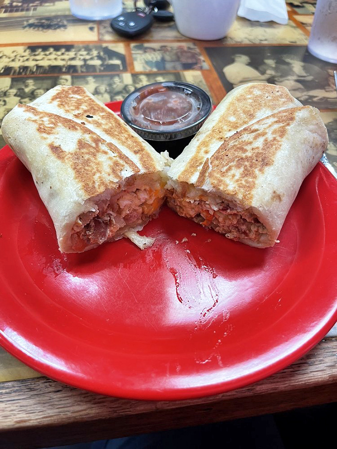 Breakfast burritos cut in half reveal their treasure—a morning masterpiece that proves Sid's isn't just an afternoon affair.