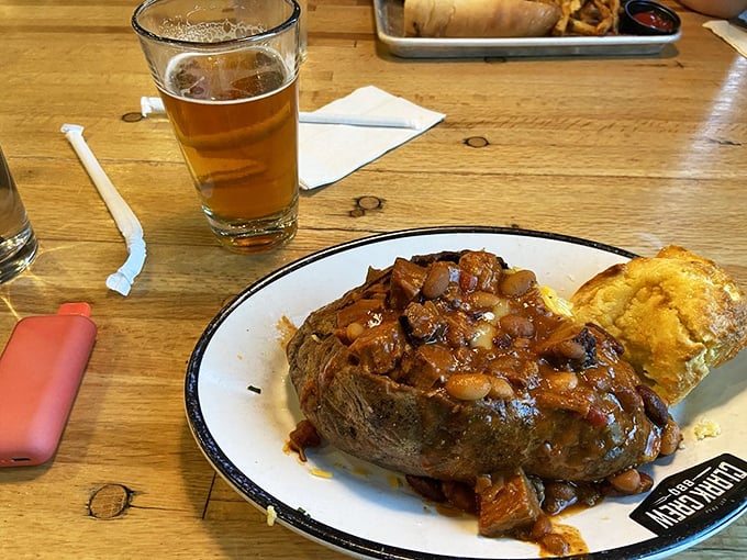 This loaded spud isn't just a potato—it's a foundation for architectural greatness, supporting a skyscraper of brisket chili and melty cheese.