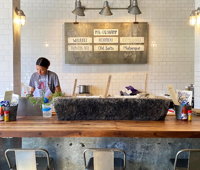 The raw bar showcases the day's freshest offerings – an altar to briny perfection where oysters are treated with the reverence they deserve.