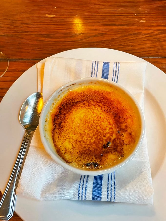 This crème brûlée isn't just dessert—it's a tiny masterpiece with a perfectly cracklable top that makes breaking into it pure therapy.