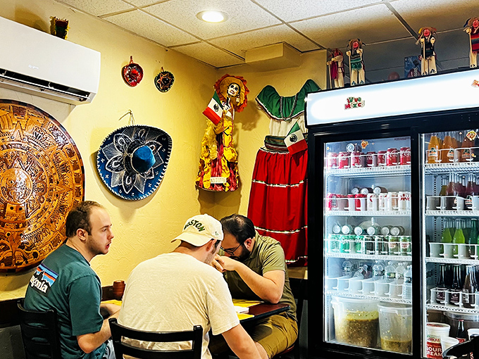 The traditional colorful décor watches over diners like cheerful guardians of authenticity. Some conversations need no translation.