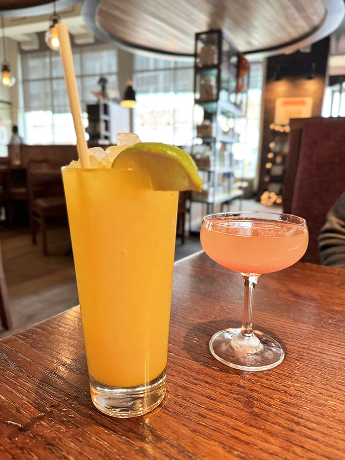 Cocktail hour done right—a tall, sunshine-yellow refresher and a delicate pink concoction in a coupe glass. Sipping these feels like an instant vacation.