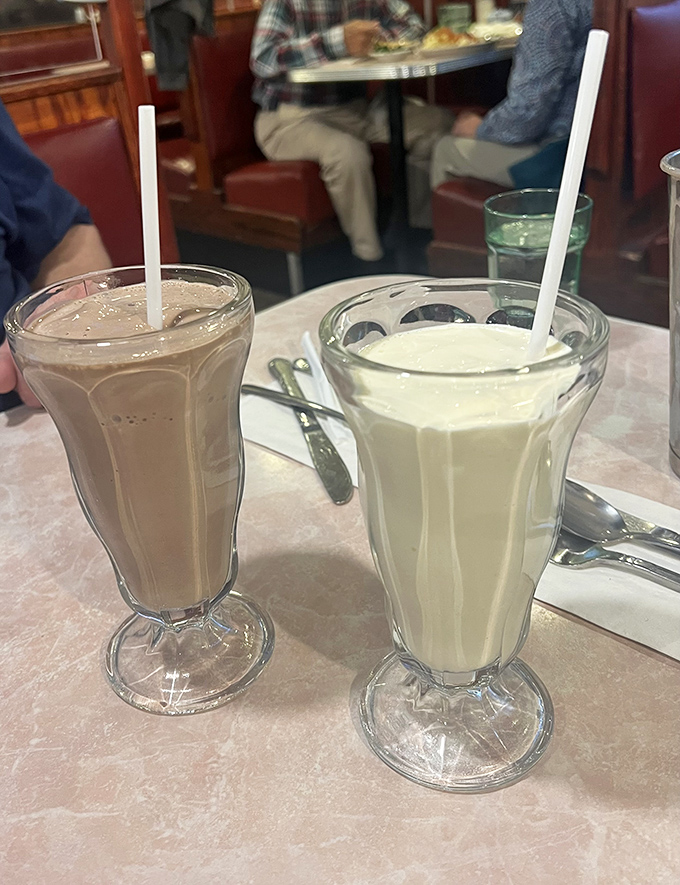 Old-school milkshakes served in those tall glasses that instantly transport you back to simpler times—thick enough to make your straw stand at attention.