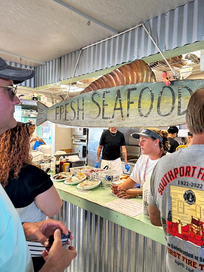 The "FRESH SEAFOOD" sign isn't just decoration – it's the restaurant's entire philosophy hanging right above your next meal.