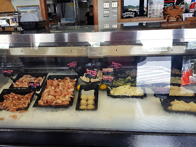 The seafood display case—a treasure chest where the gems aren't rubies and emeralds, but jumbo shrimp and lump crabmeat.