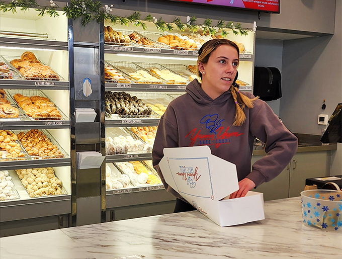 Refrigerated cases stocked with drinks – because even the most passionate donut enthusiast occasionally needs hydration between sugar rushes.