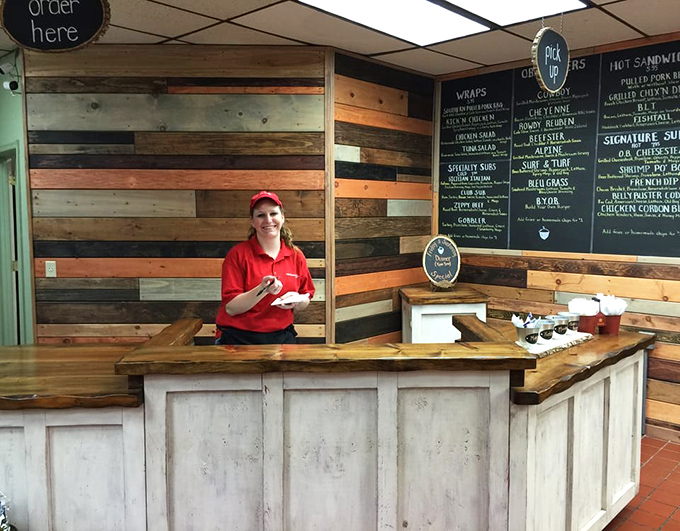 The ordering counter—where dreams and hunger meet. Friendly staff ready to guide you through a menu of temptations.