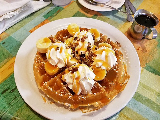 This isn't just a waffle—it's a throne for whipped cream, bananas, and pecans to hold court over your breakfast expectations.