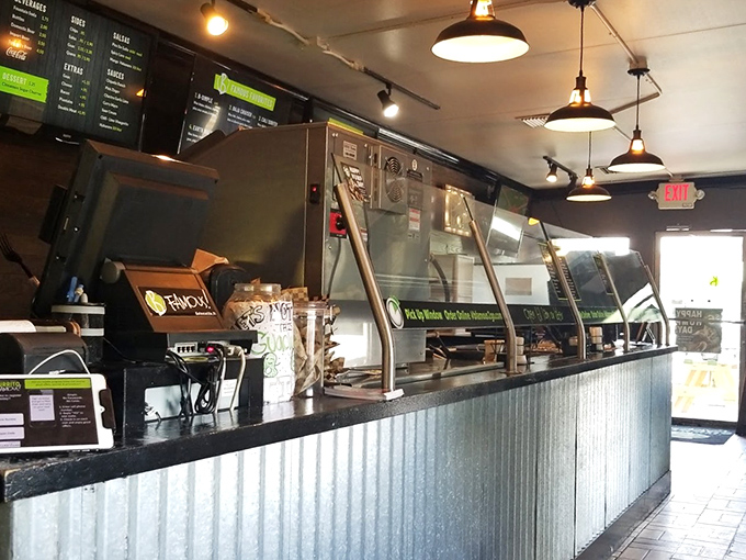 The assembly line of possibility—where dreams become burritos and hunger transforms into anticipation behind that corrugated metal counter.