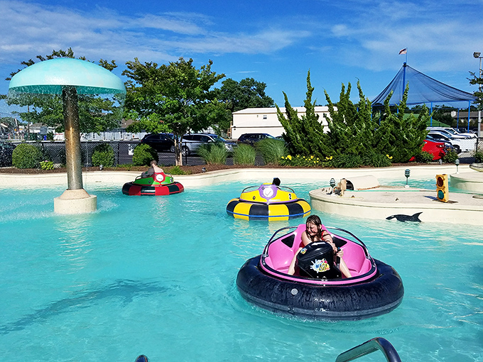 Bumper boats bring the joy of dodgems to water – colorful vessels ready for gentle collisions and uncontrollable laughter on a hot summer day.