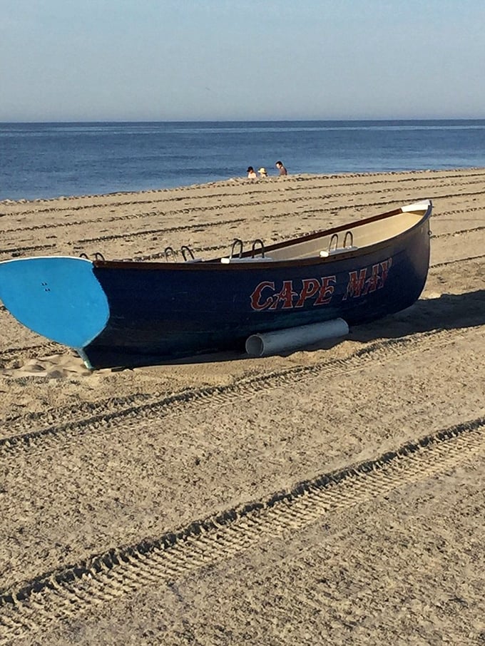 A lonely lifeguard boat waits for summer crowds – like a sentinel of sand with the best office view in New Jersey.