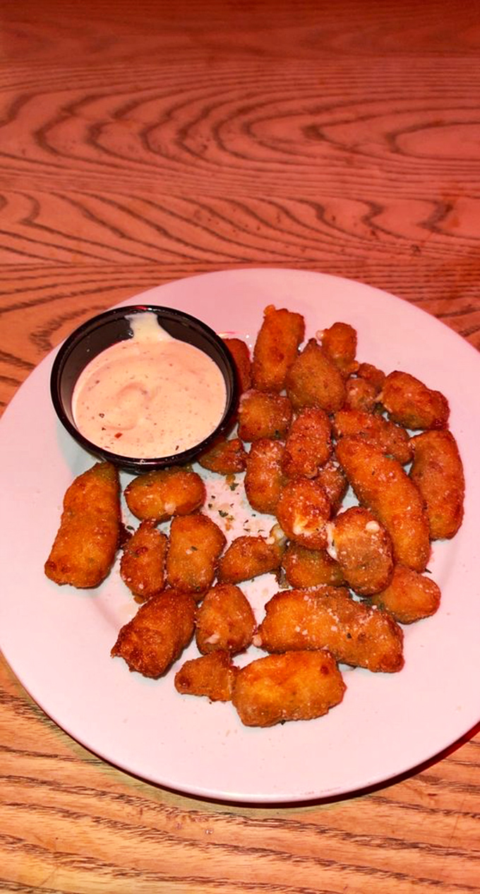 These cheese curds aren't just fried—they're transformed into golden nuggets that squeak in your mouth and sing in your soul.