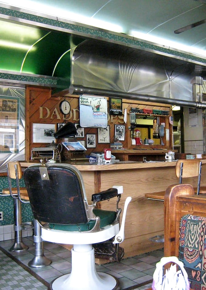 That barber chair isn't just decoration—it's a reminder that Daddypops is where community happens, haircuts or hamburgers, your choice.