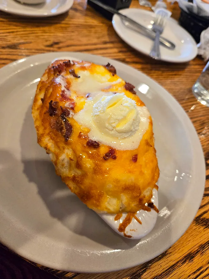 This isn't just a baked potato—it's a cheese-crowned, butter-melting masterpiece that makes you question why you'd ever eat anything else.