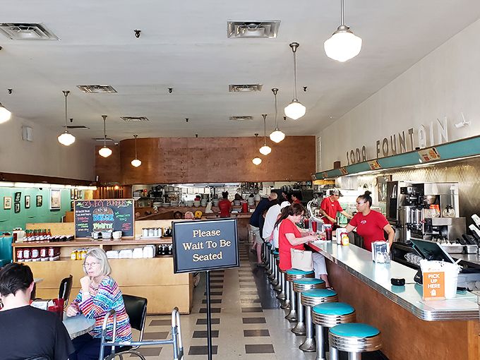 The counter seating isn't just functional—it's front-row tickets to the short-order ballet performed daily by cooks who make multitasking an art form.
