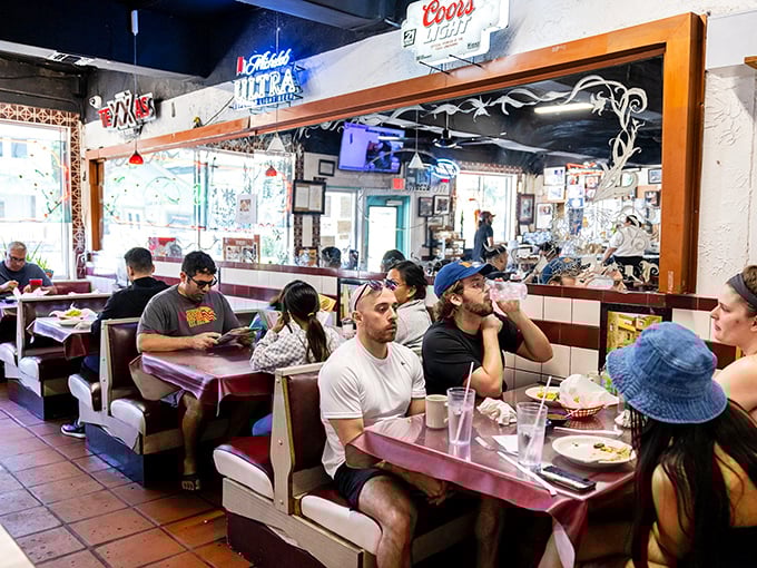 The dining room hums with the universal language of satisfied eaters. Notice how nobody's looking at their phones—the food demands full attention.