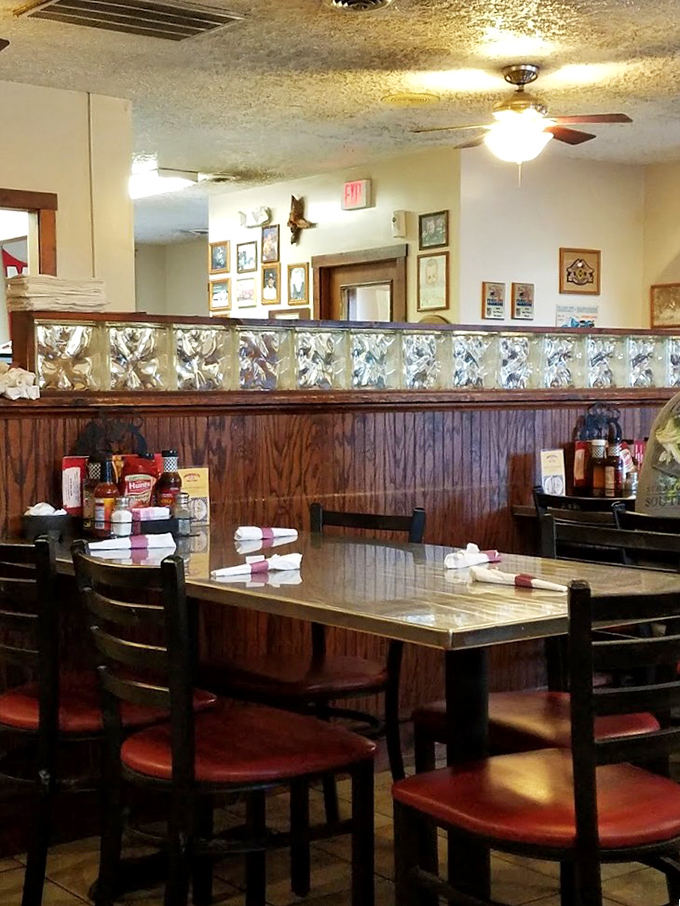 Simple tables, wood paneling, and the promise of meat sweats. This dining room doesn't need fancy—it lets the food do all the talking.