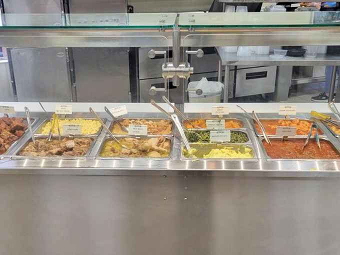 Hot food station featuring home-style Cuban classics. These steam trays don't just hold food—they preserve cultural heritage one spoonful at a time.