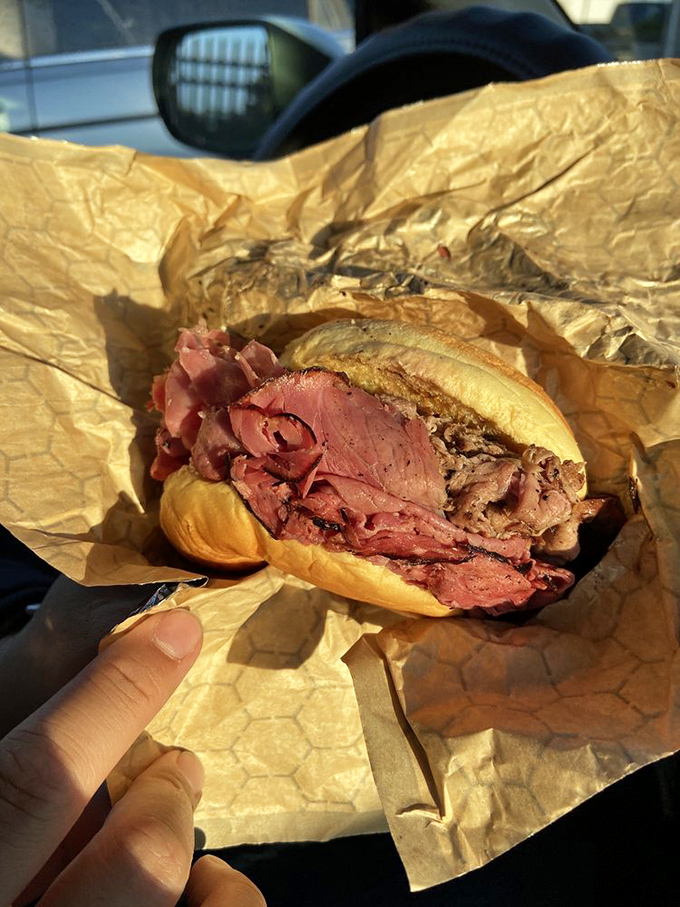 A study in contrasts—the rosy pink of ham alongside the deeper hues of beef. Meat harmony achieved on humble brown paper.