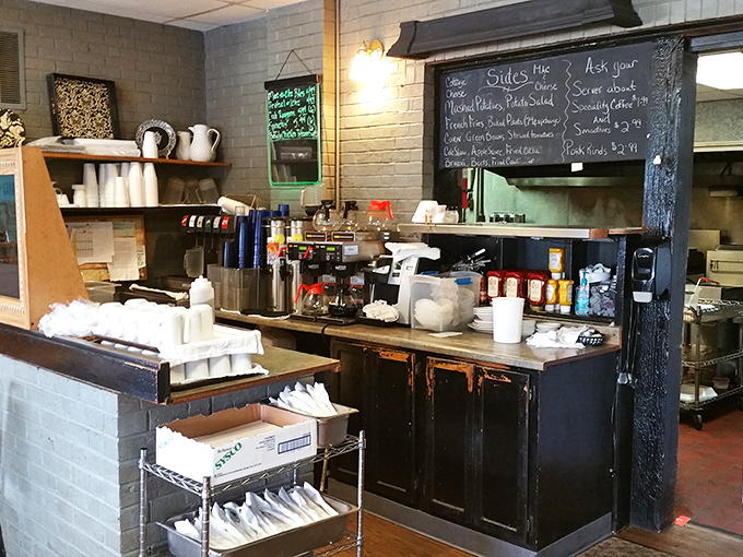 Where the magic happens – a working kitchen with handwritten specials on the chalkboard, the ultimate sign of a place that adapts to what's fresh.