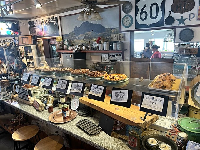 Pie lineup that would make a pastry chef weep with joy. Each labeled creation is a different path to happiness.