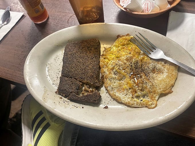 Scrapple and eggs—a breakfast combination that's sparked more Delaware debates than politics. The crispy edges tell me someone in the kitchen cares.
