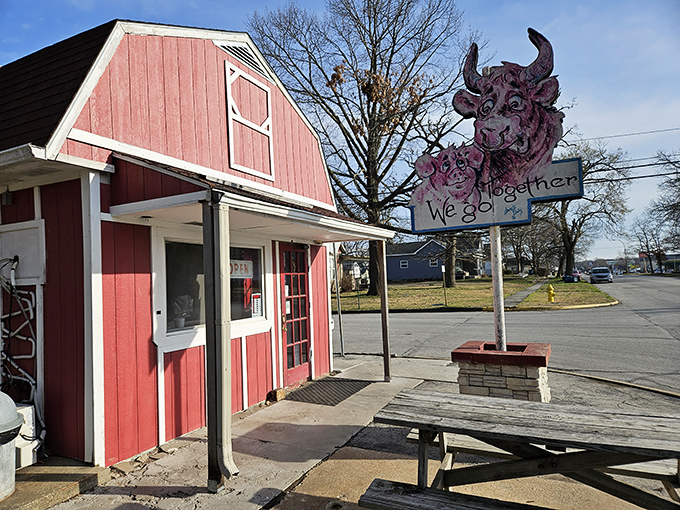 Whisler's Drive-Up, with its barn-red charm and quirky cow sign, serves up nostalgia alongside burgers. Fast food before it was fast.