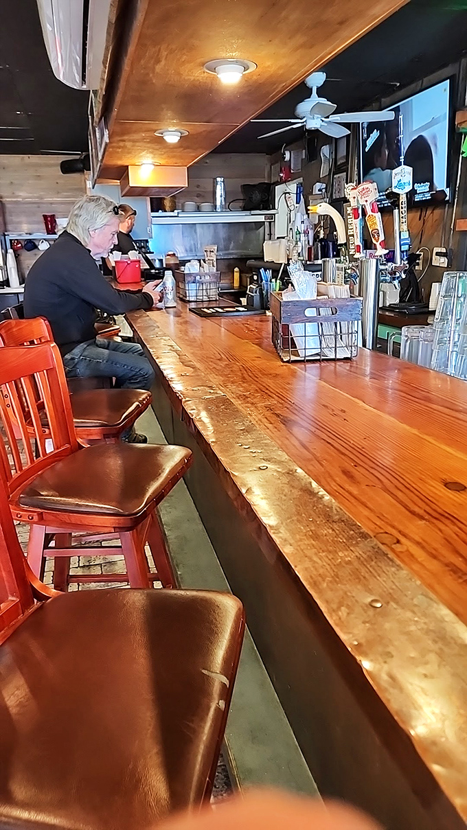 The bar at Bernie's—where wooden surfaces tell stories of countless elbows, toasts, and "you've got to try this" conversations.