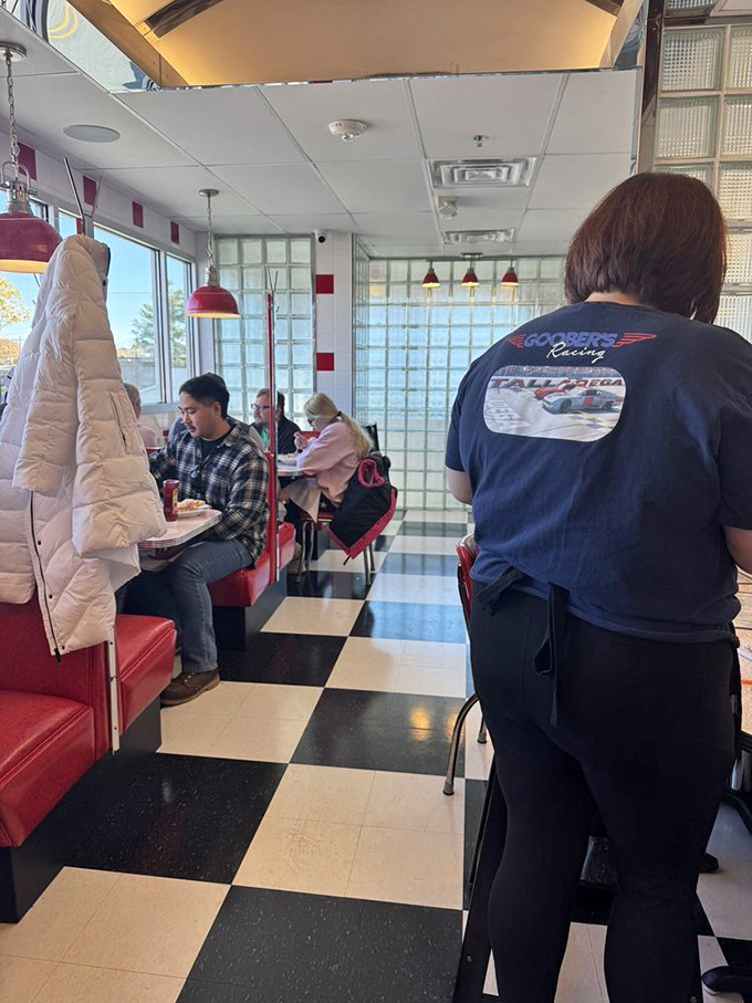 Where strangers become neighbors over coffee and conversation, the checkered floor a game board where everyone wins at comfort food.